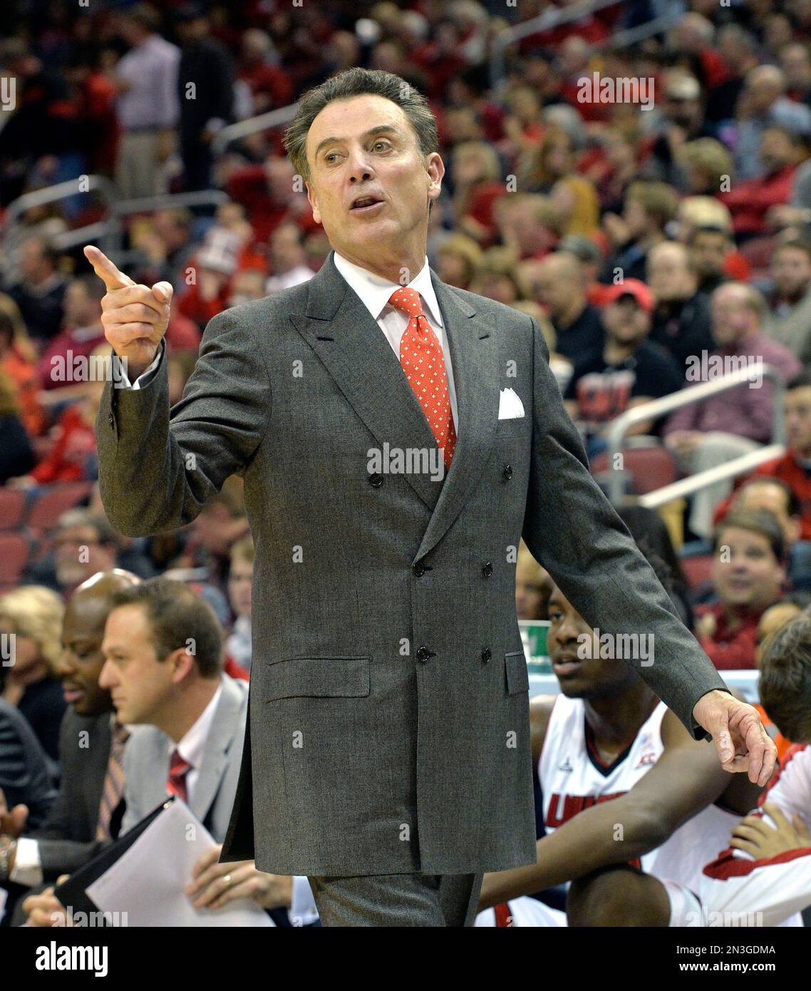 Louisville head coach Rick Pitino shouts instructions to his team ...