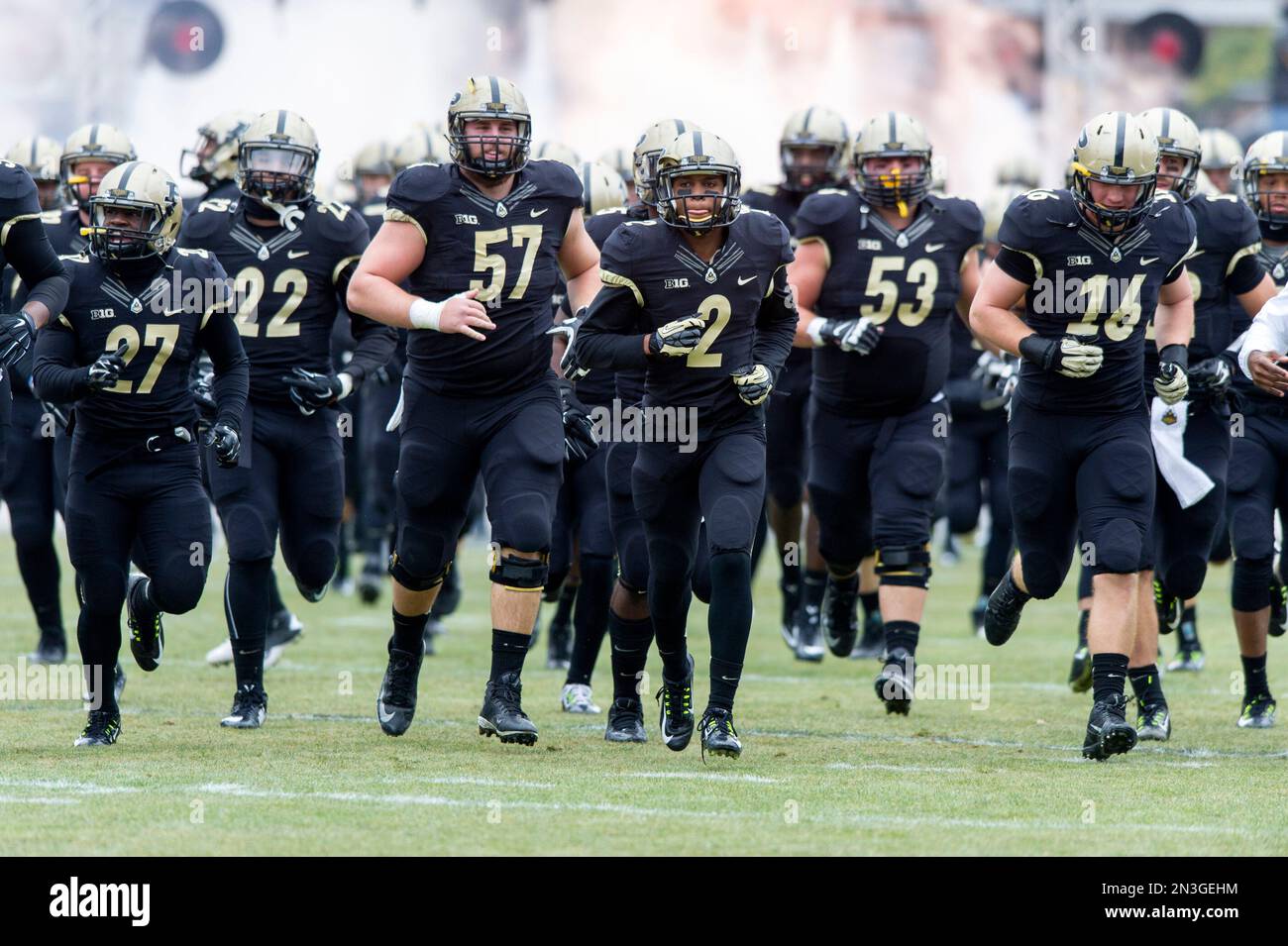 The Purdue Boilermakers run onto the field during team introductions of ...
