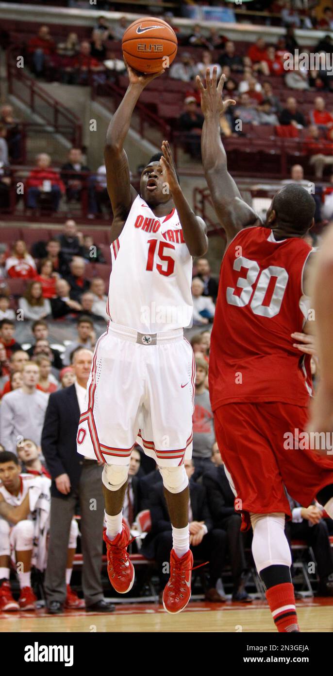 Ohio State's Kam Williams, left, goes up for a shot against Sacred ...