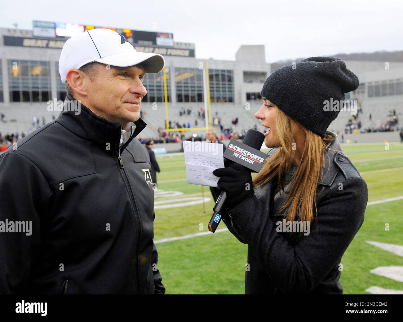 Army head coach Jeff Monken ,left, talks with CBS Sports Network ...
