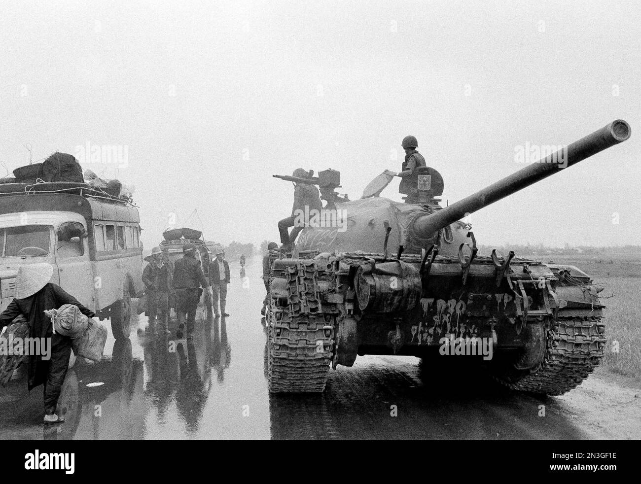 South Vietnamese soldiers drive a captured North Vietnamese T-54 tank ...