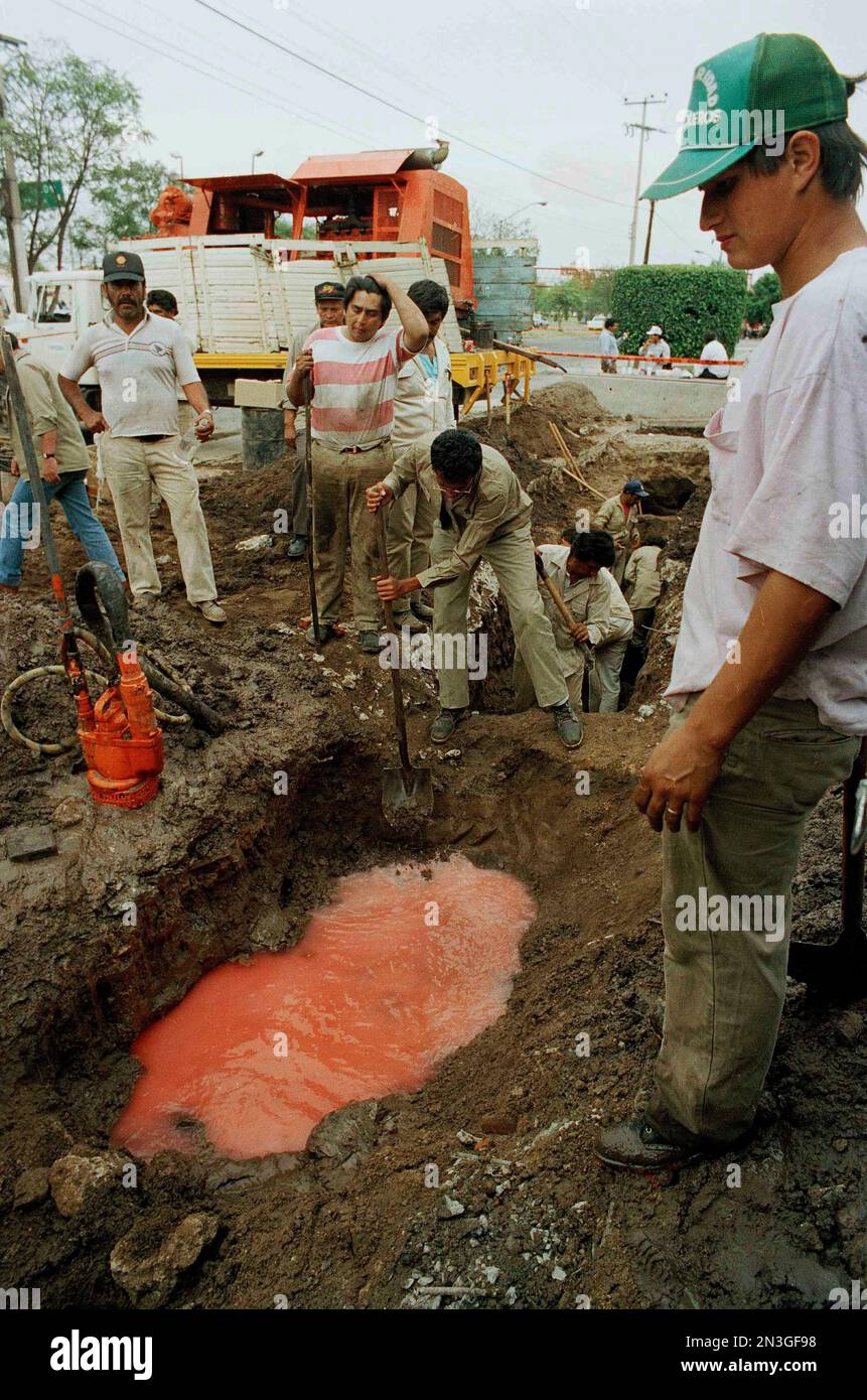 A pool of flammable liquid thought to be gasoline is uncovered by ...