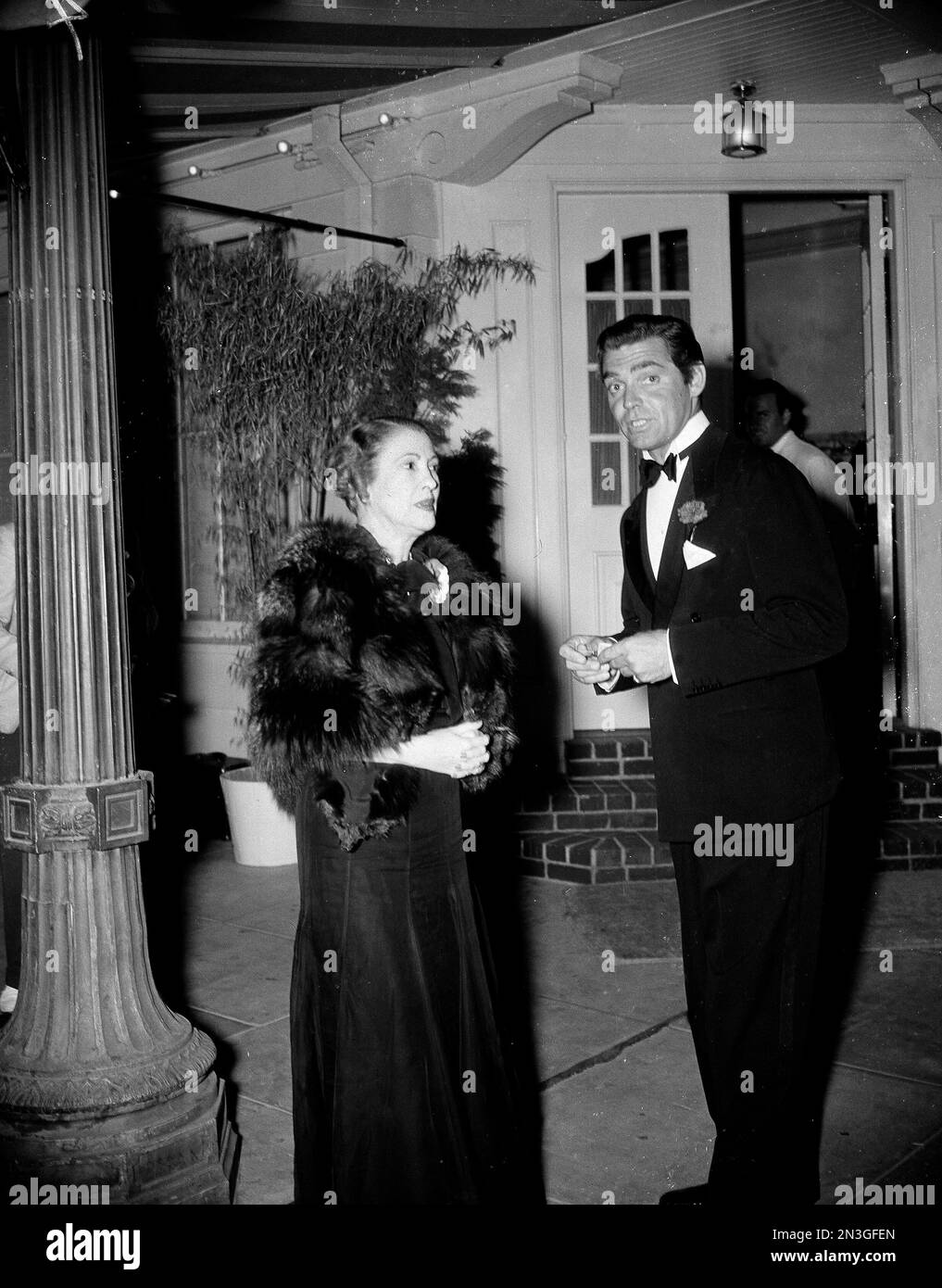 Actor Clark Gable and his wife Maria are pictured just outside of the ...