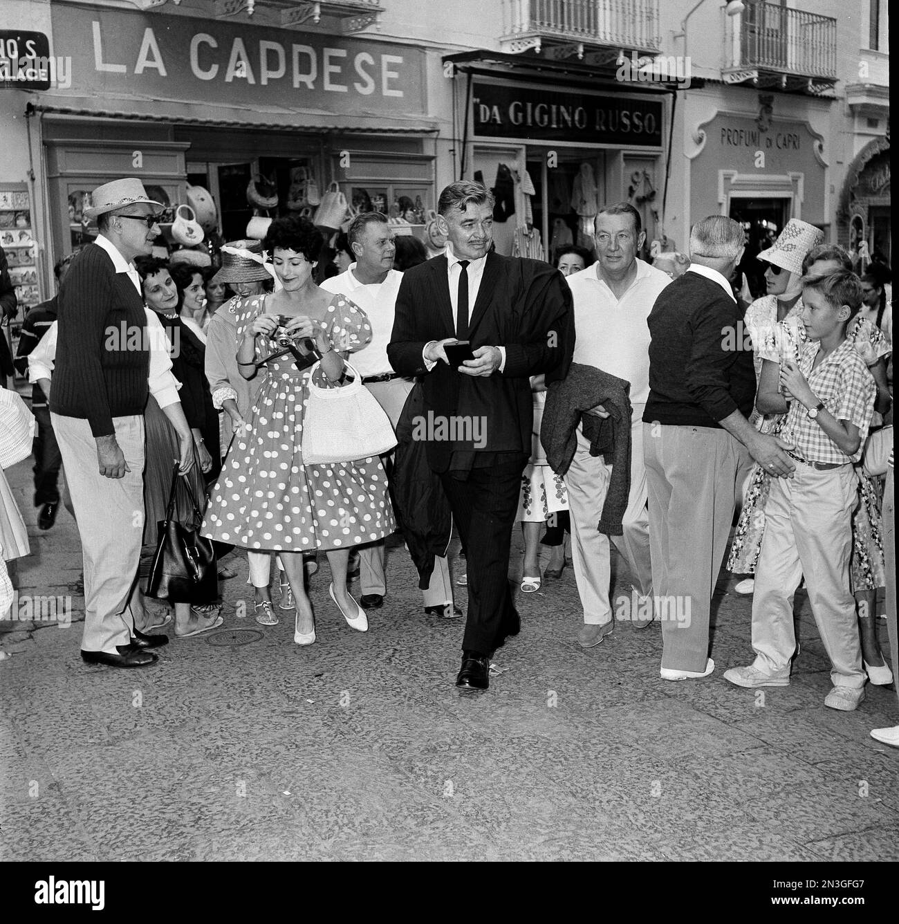 Veteran American screen actor Clark Gable is surrounded by fans as he ...