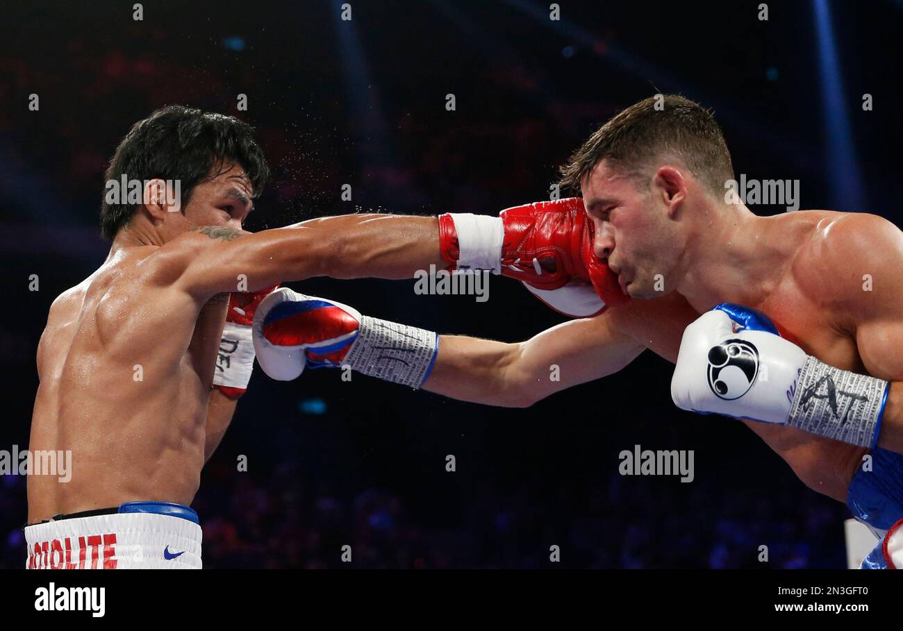 WBO welterweight champion Manny Pacquiao, left, of the Philippines lands a right on the face of ...