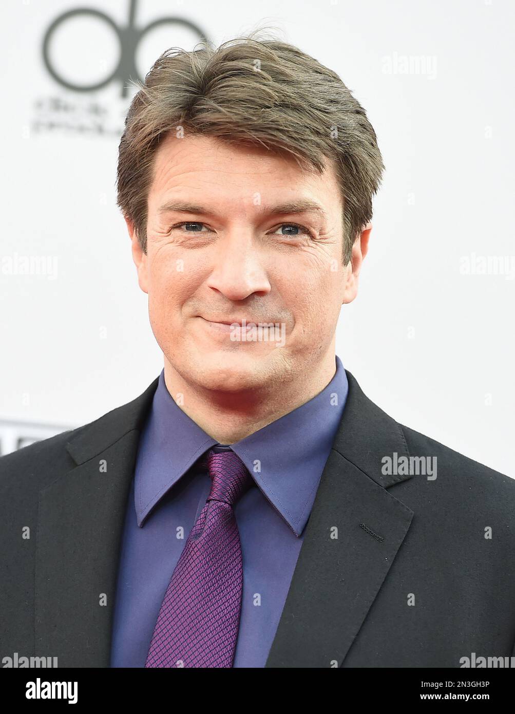 Nathan Fillion arrives at the 42nd annual American Music Awards at ...