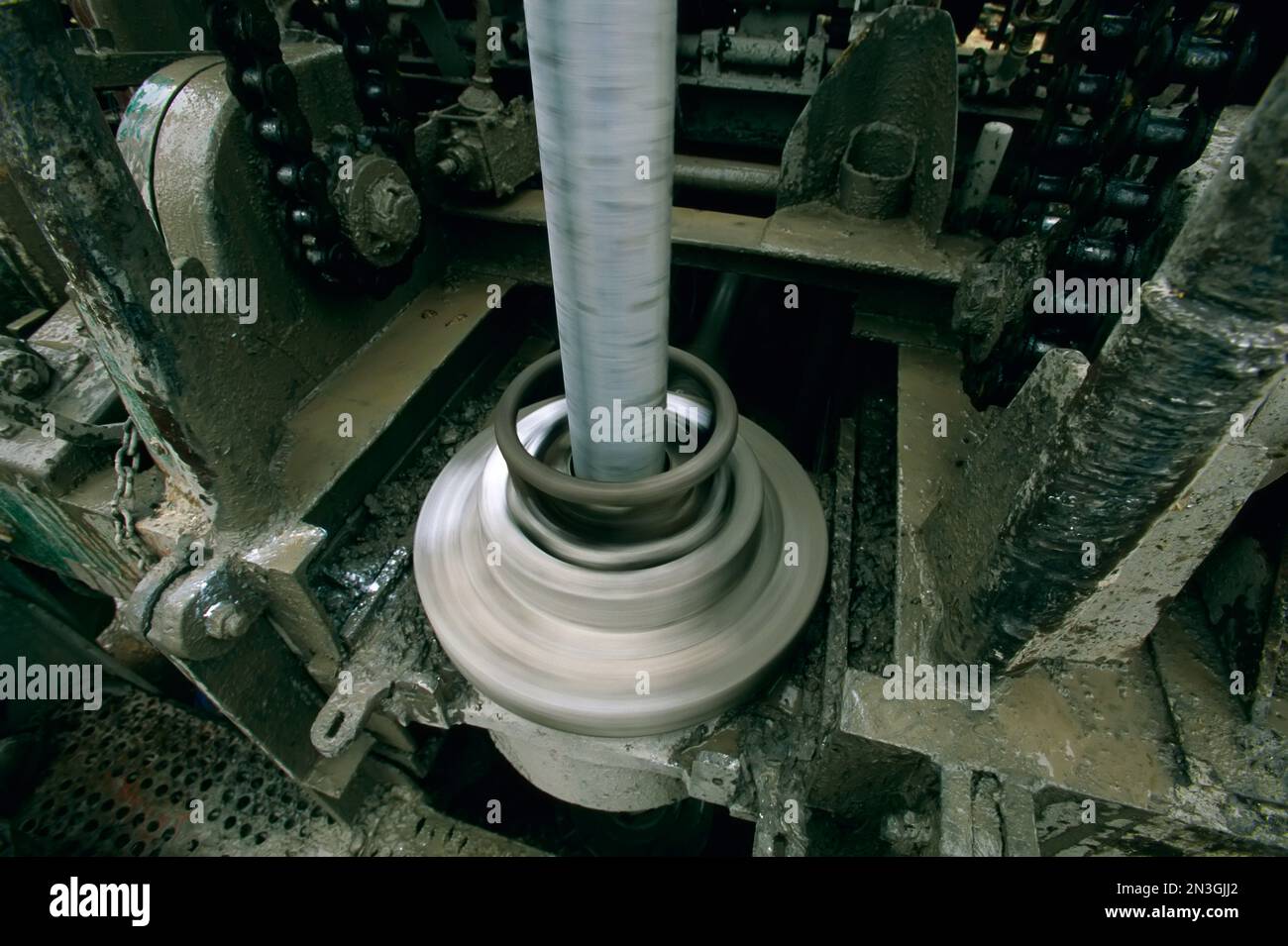 A drilling rig turns for hours on end at a coal bed methane well site ...