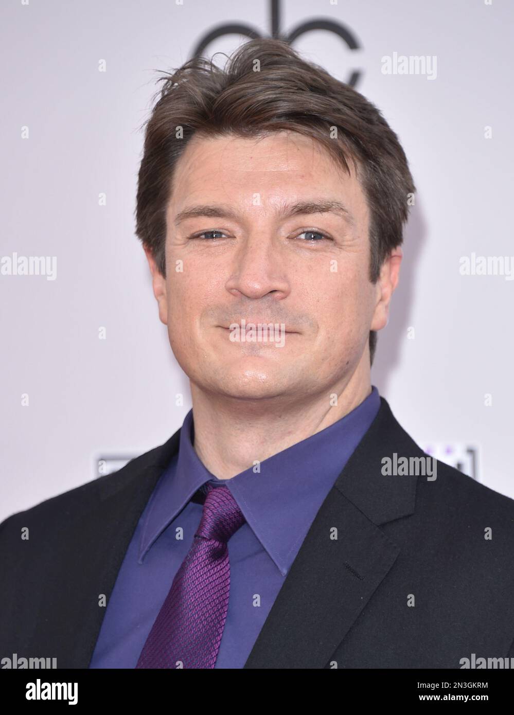 Nathan Fillion arrives at the 42nd annual American Music Awards at ...