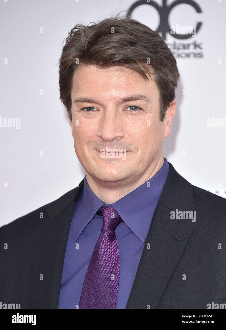 Nathan Fillion arrives at the 42nd annual American Music Awards at ...
