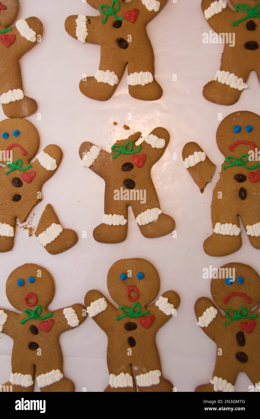 Cookie sheet of gingerbread men with different facial expressions ...
