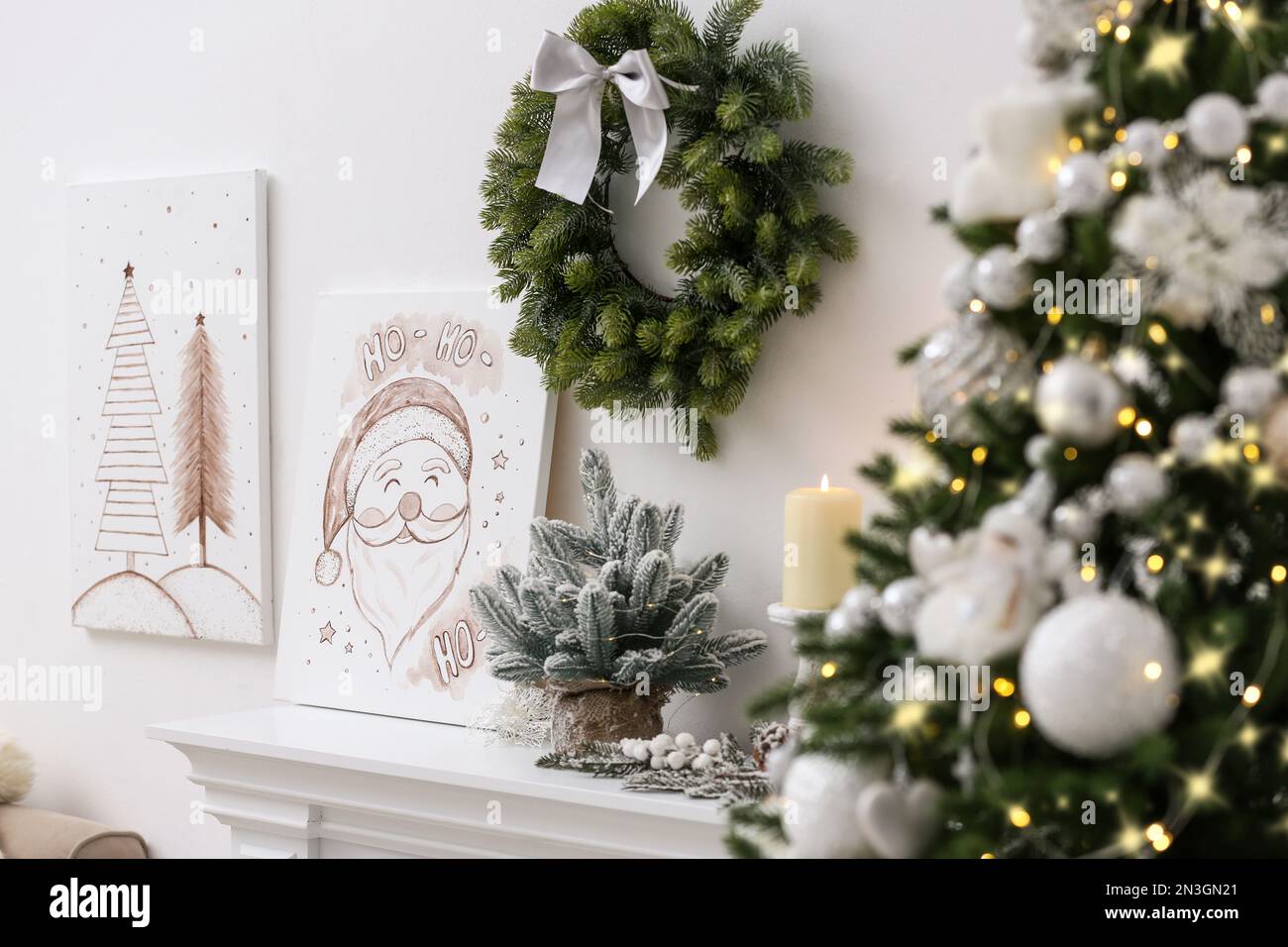 Beautiful Christmas pictures in festive room interior Stock Photo - Alamy