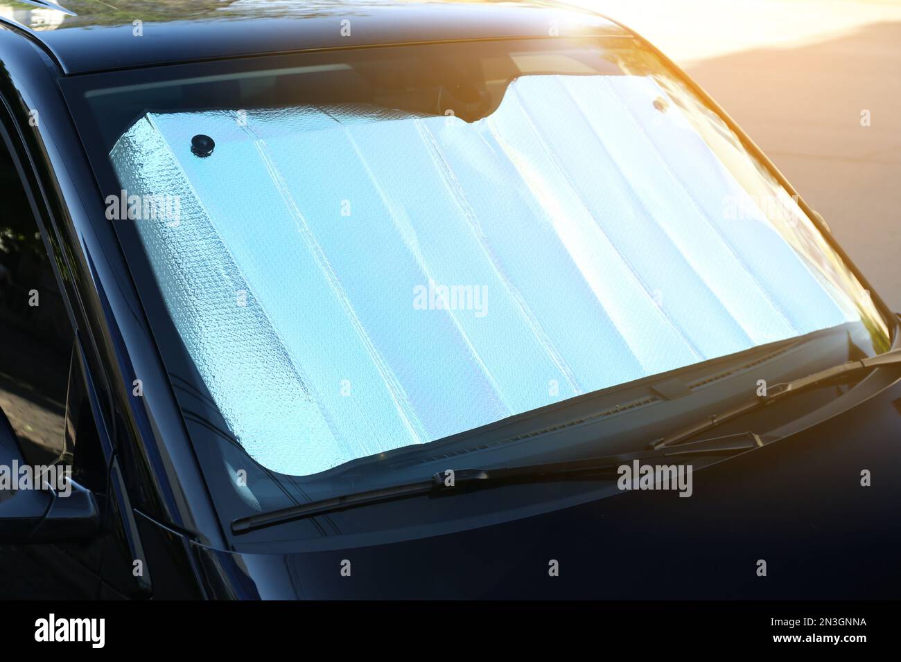 Sun shade under windshield inside car, closeup. Heat protection Stock ...
