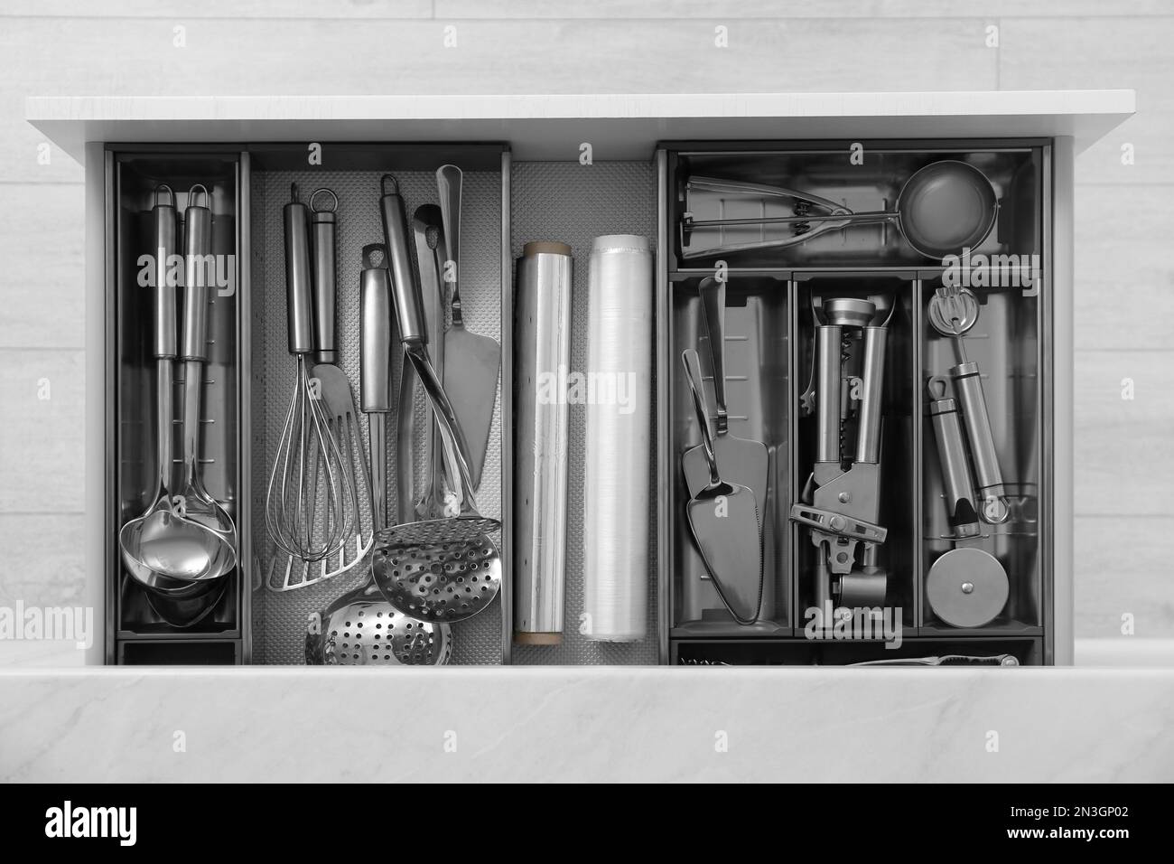 Drawer with stainless steel utensil set, top view. Order in kitchen ...