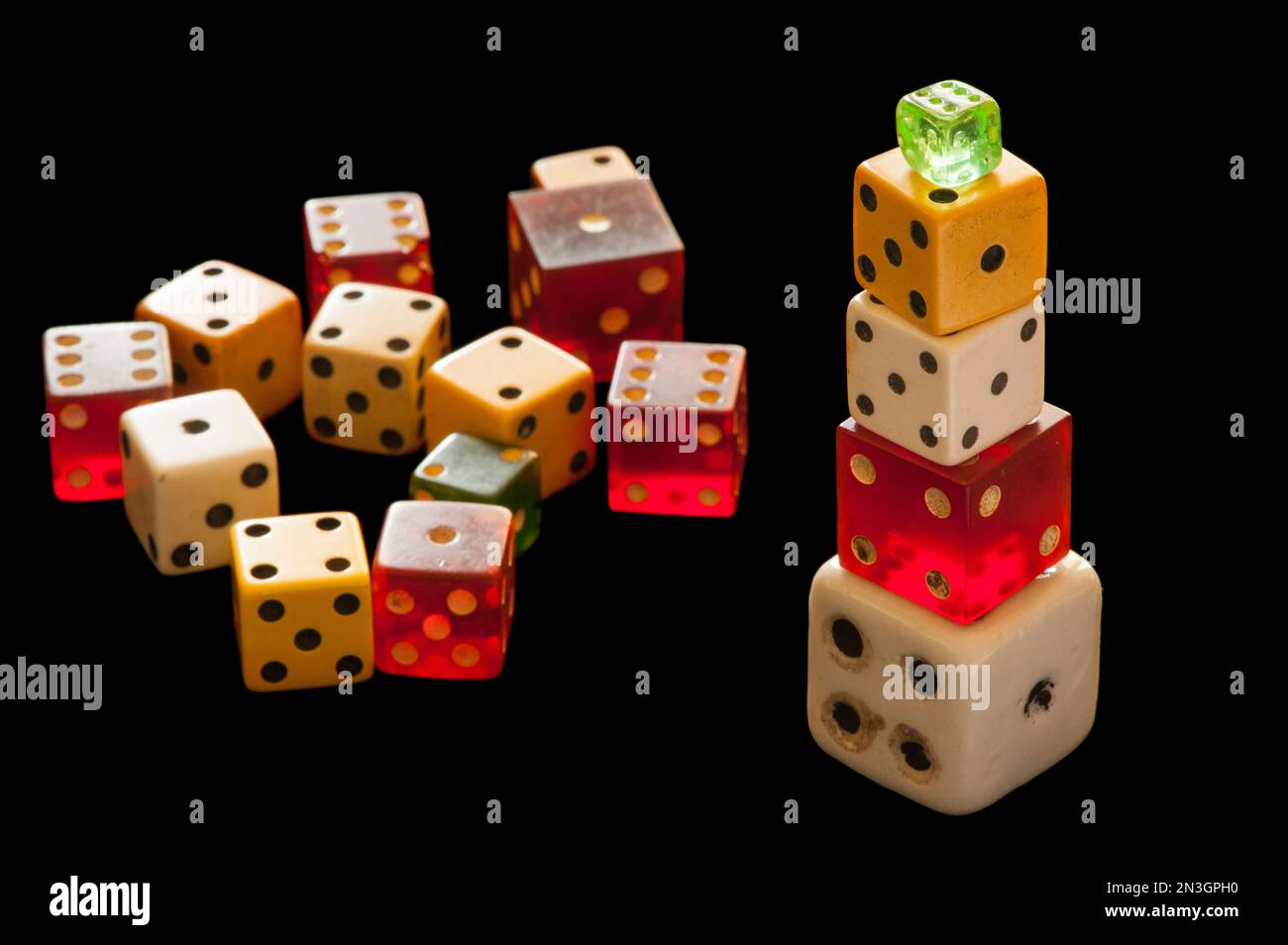 Studio image of dice on a black background; Studio Stock Photo - Alamy