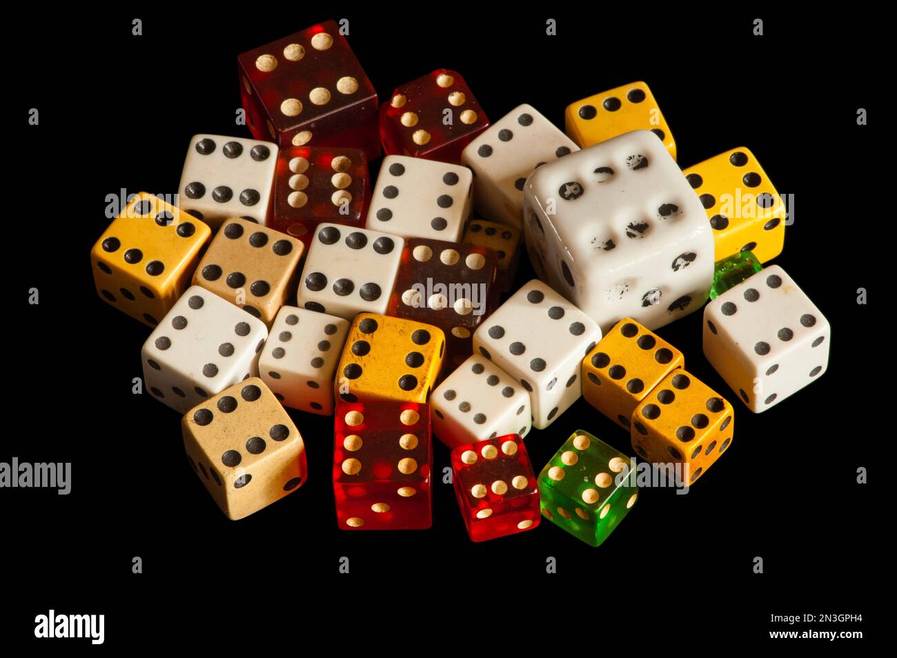 Studio image of dice on a black background; Studio Stock Photo - Alamy
