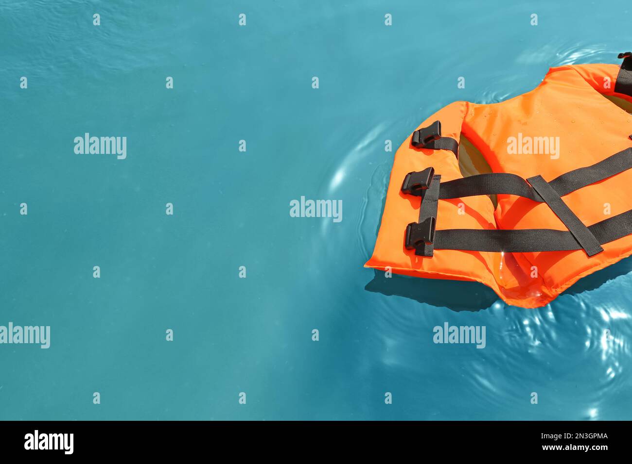 Orange life jacket floating in sea. Emergency rescue equipment Stock ...