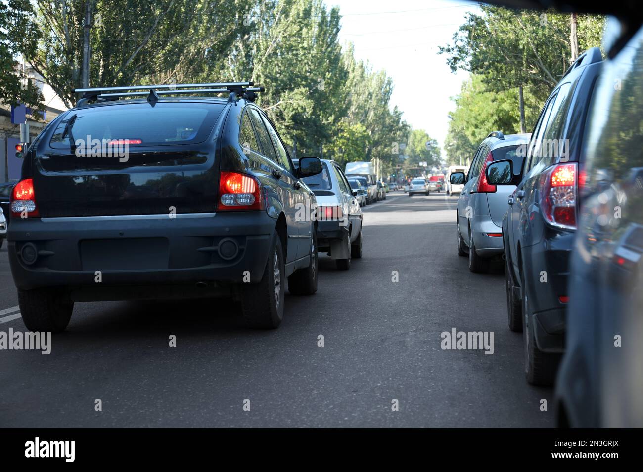 Cars in traffic jam on city street Stock Photo - Alamy