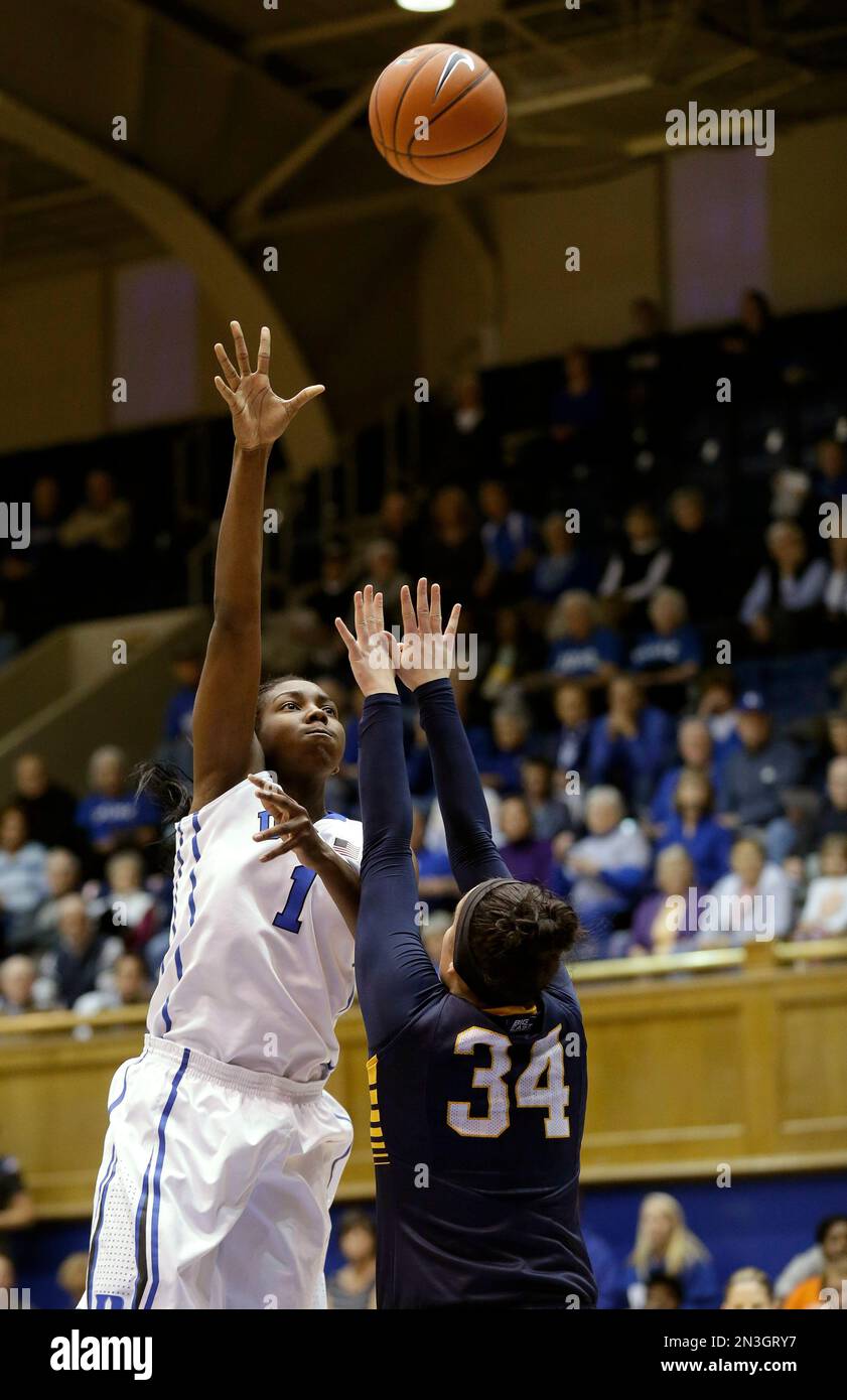 Duke's Elizabeth Williams (1) shoots over Marquette's Chelsie Butler ...