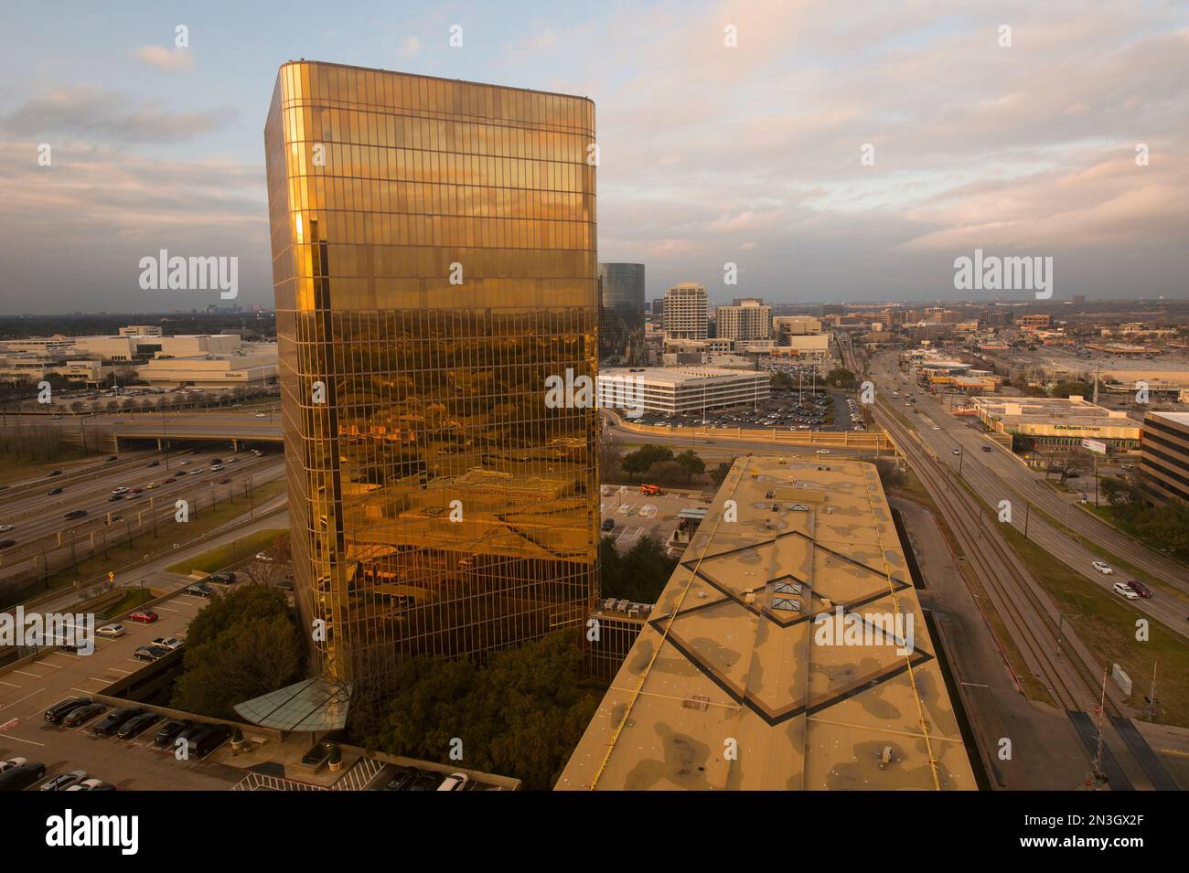 Skyscraper in gold facade reflecting a North Dallas neighborhood in ...