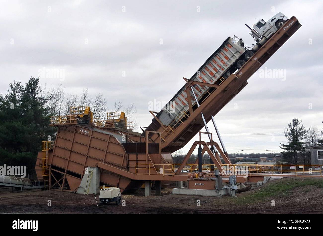In this Nov. 12, 2014 photo, a tractor-trailer loaded with wood chips ...