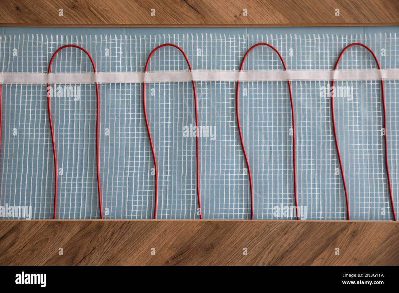 Installation of modern underfloor trace heating system indoors, top ...