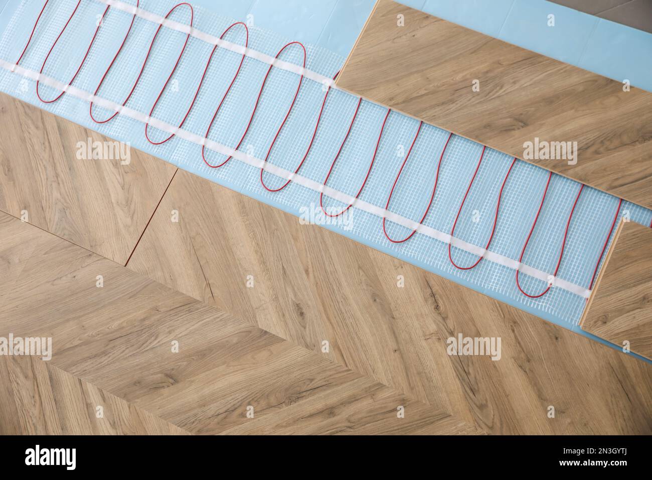 Installation of modern underfloor trace heating system indoors, top ...