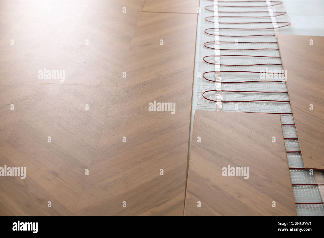 Installation of modern underfloor trace heating system indoors Stock ...