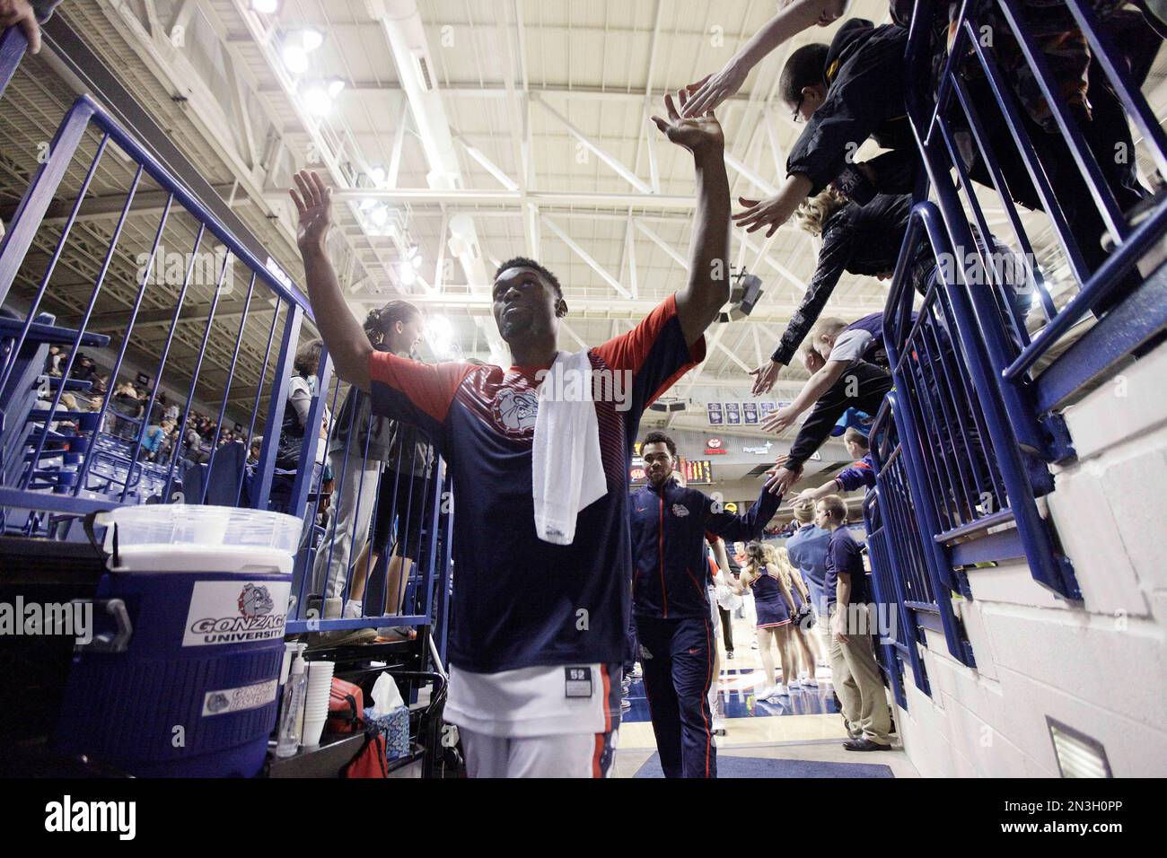 Gonzaga's Gary Bell Jr. high fives a fan after an NCAA college ...