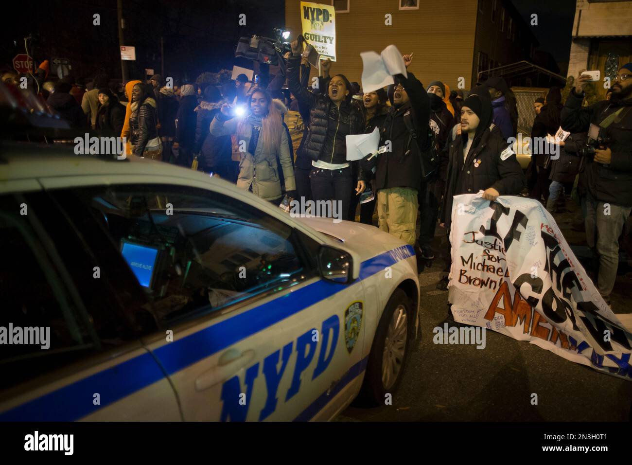 Demonstrators chant outside the 75th Police Precinct during a march in ...