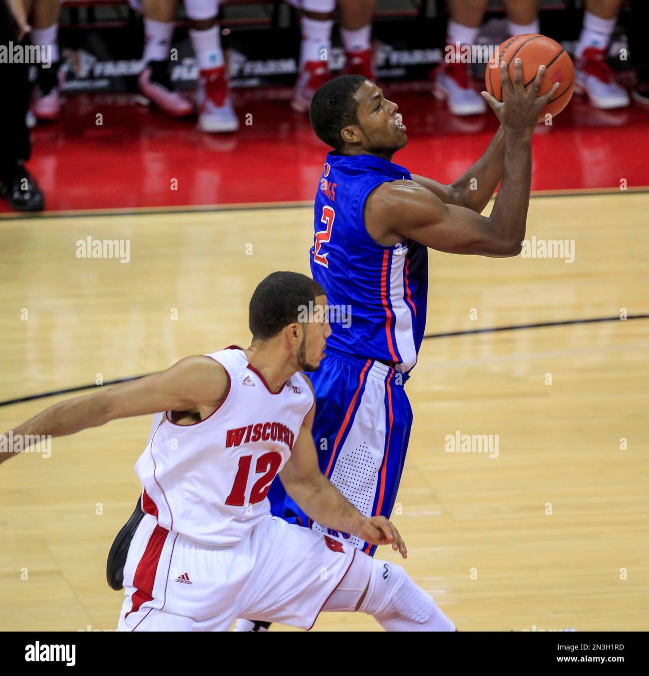 Boise State's Kevin Allen shoots past Wisconsin's Traevon Jackson (12 ...