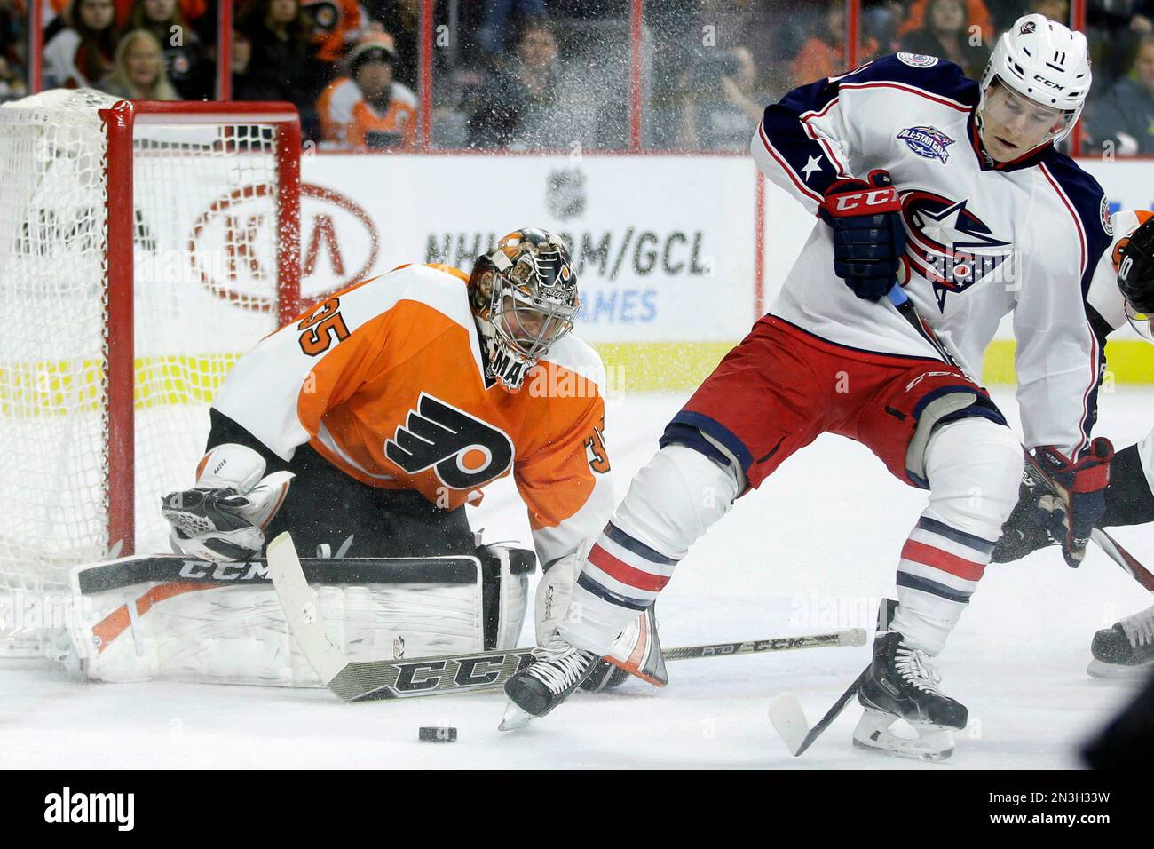 Philadelphia Flyers' Steve Mason (35) blocks a shot past Columbus Blue ...