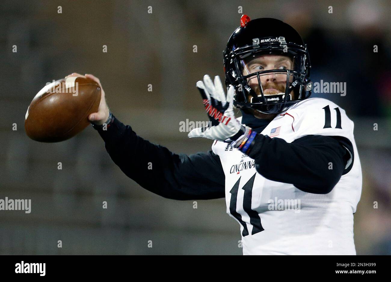 Cincinnati quarterback Gunner Kiel (11) warms up before an NCAA college ...