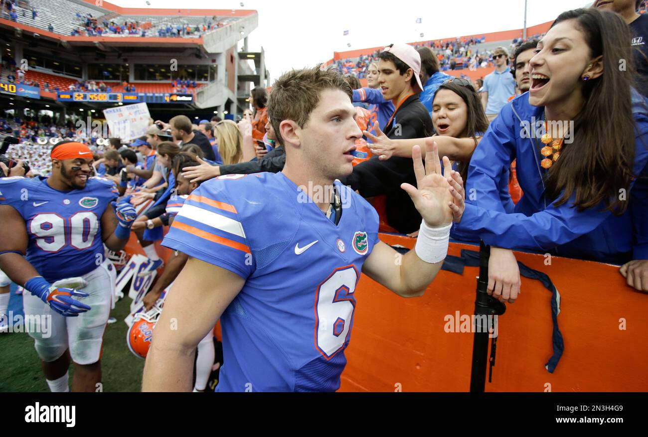 Florida quarterback Jeff Driskel (6) and defensive lineman Jonathan ...