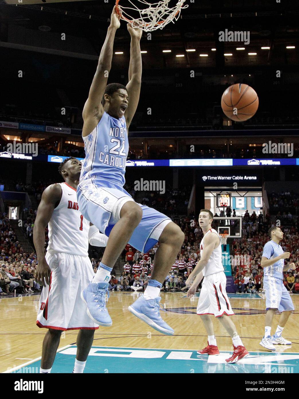 North Carolina's Isaiah Hicks (22) dunks past Davidson's Nathan Ekwu (1) during the second half ...