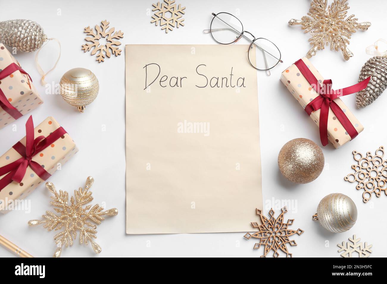 Flat lay composition with letter saying Dear Santa on white background ...