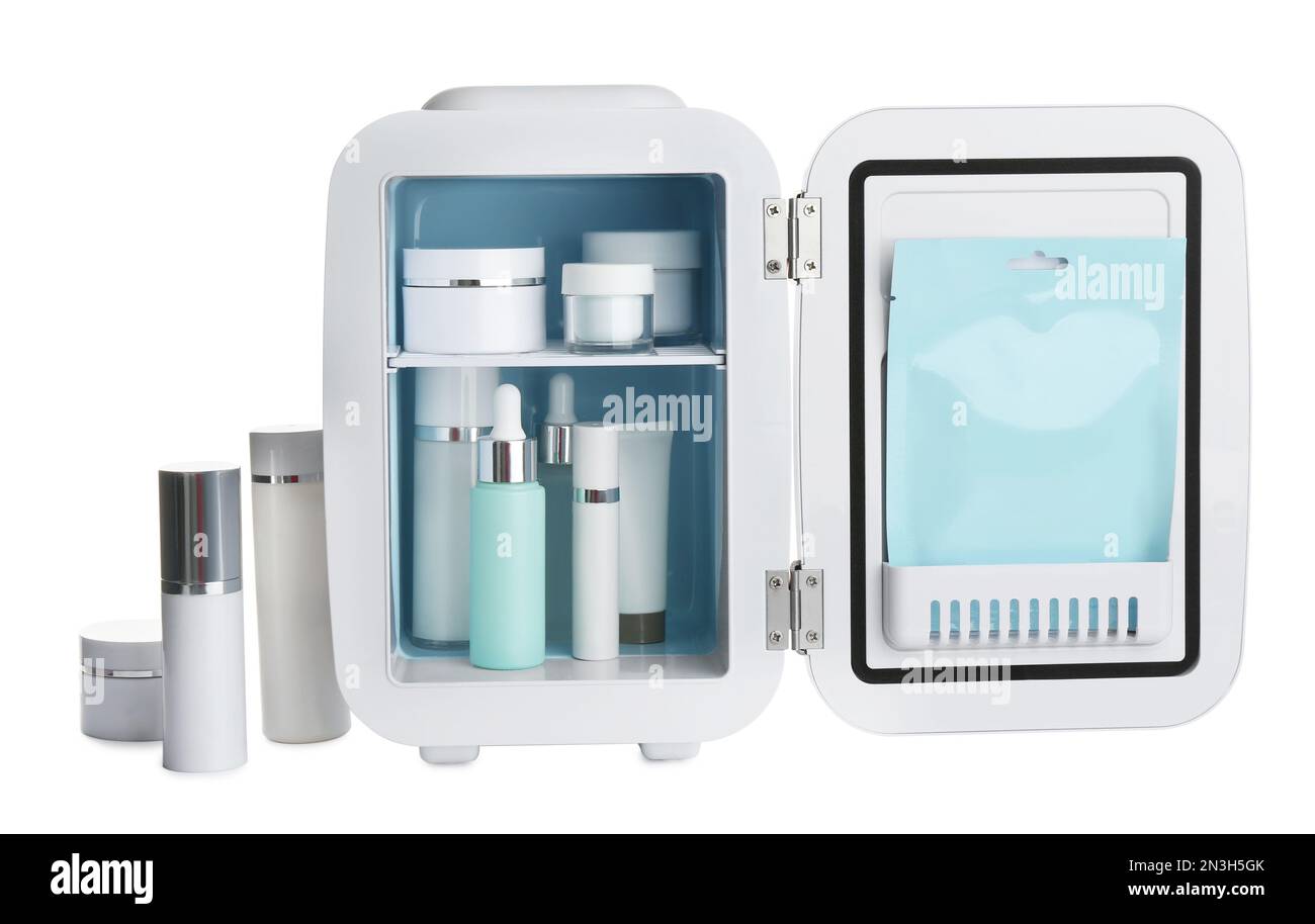 Cosmetics refrigerator with skin care products on white background ...