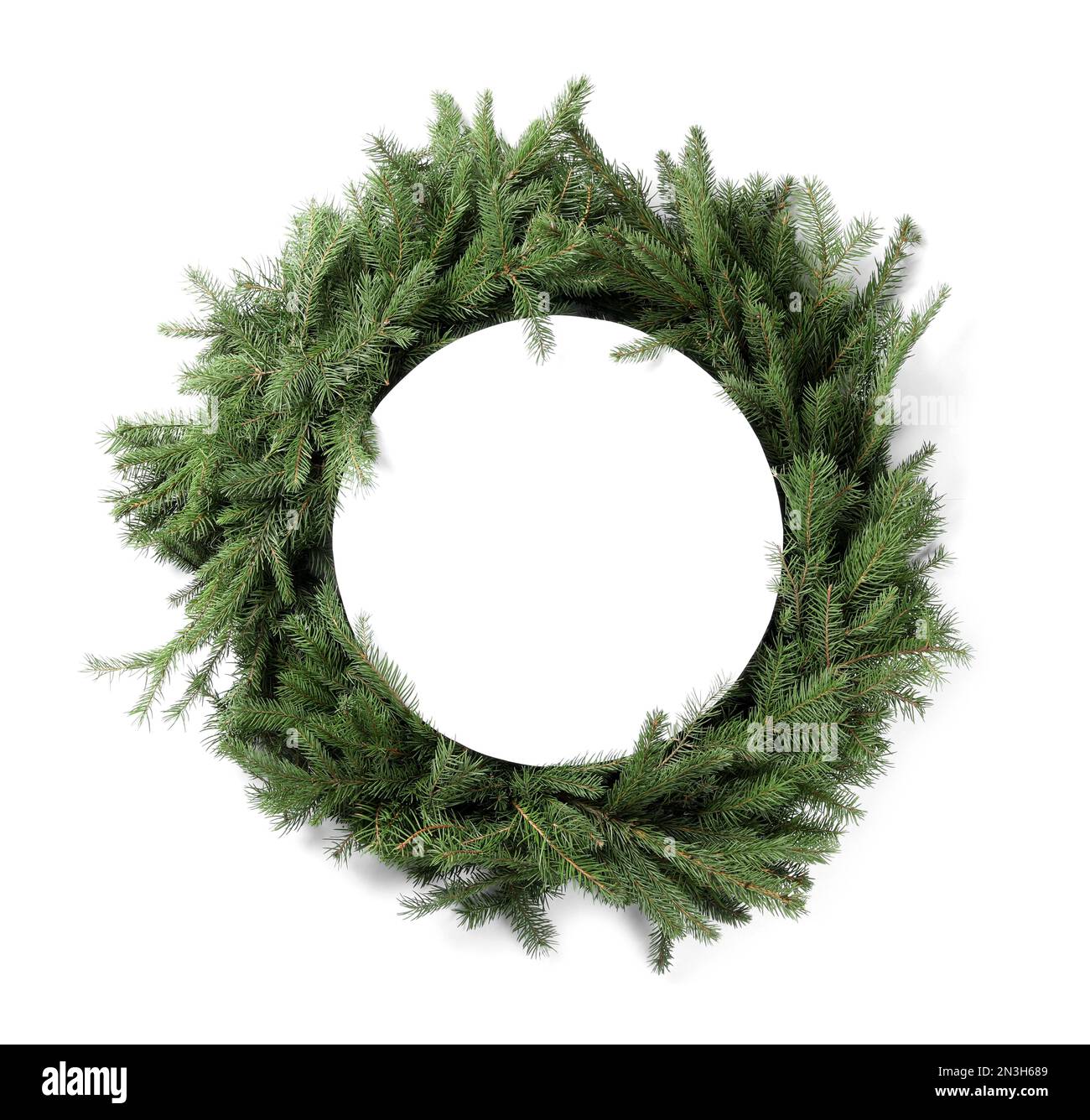 Christmas wreath made of fir branches with blank card on white ...