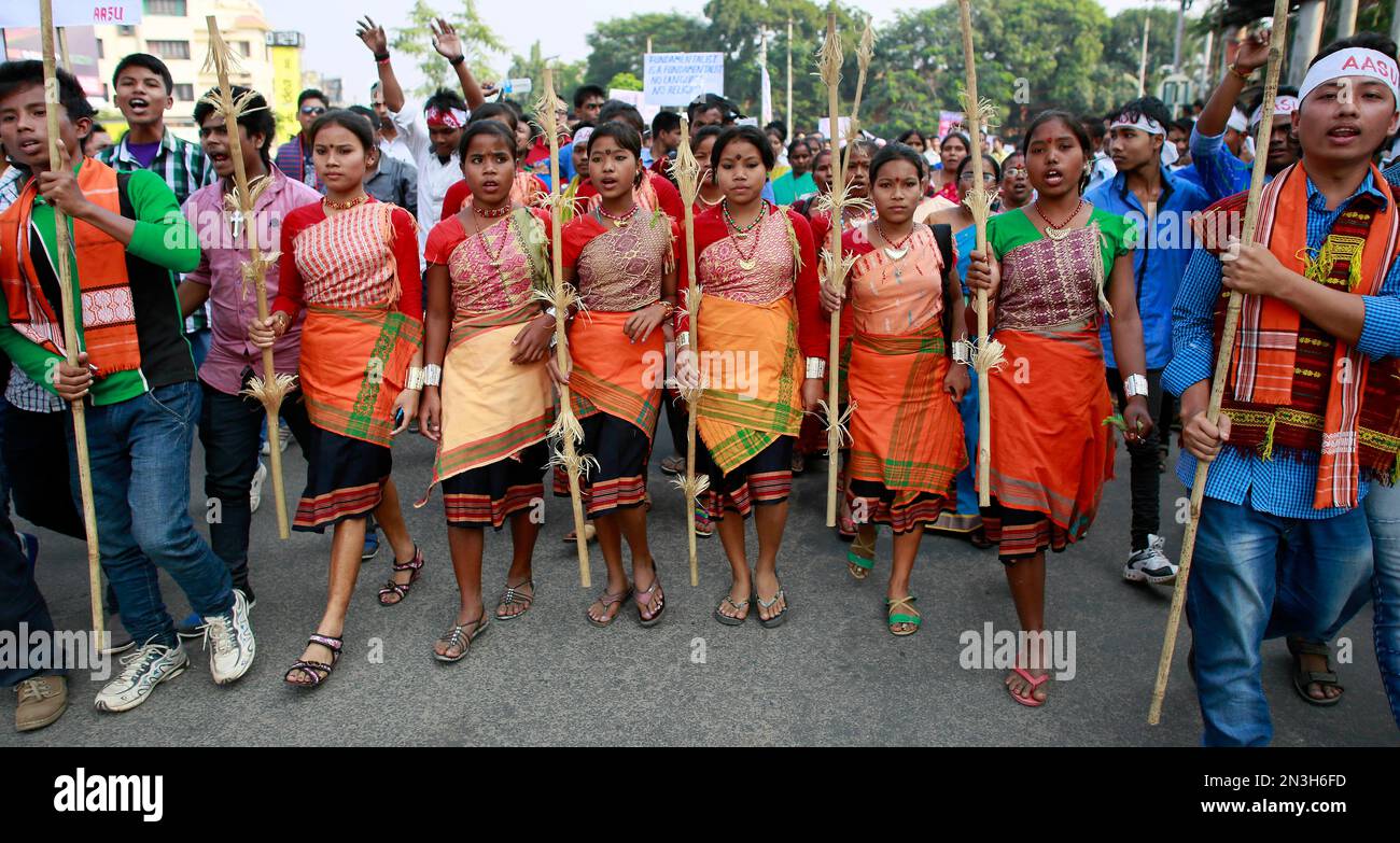 Tiwa tribals, in traditional attire, join others in a procession ...