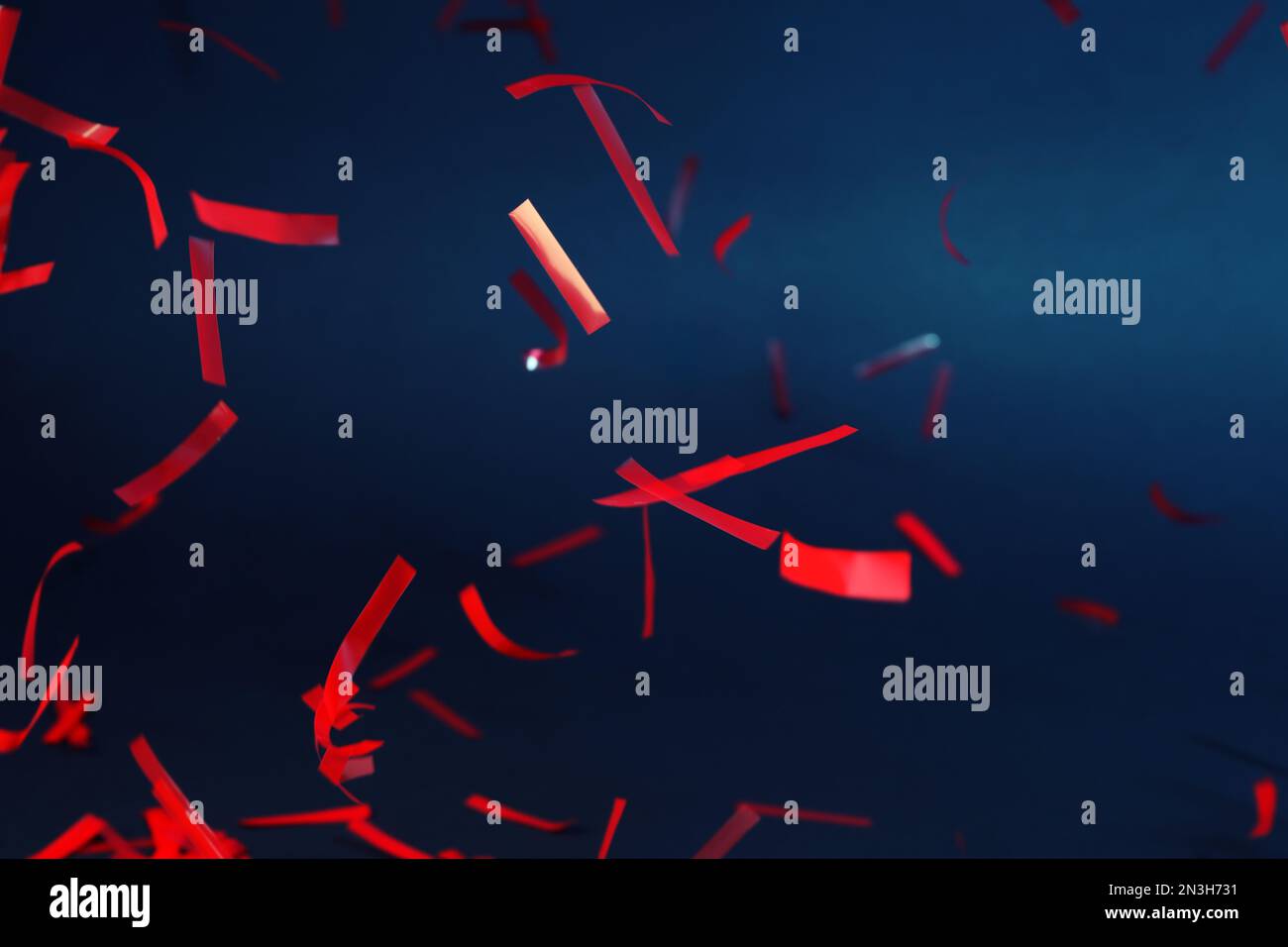 Red confetti falling on black hi-res stock photography and images - Alamy