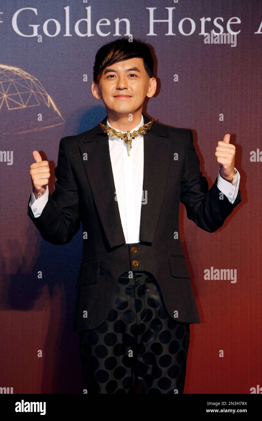 Taiwanese actor Mickey Huang poses on the red carpet at the 51st Golden ...