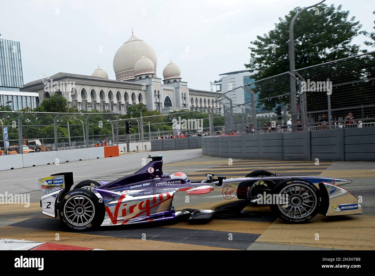 Virgin Racing driver Sam Bird of Britain steers his card past the the ...