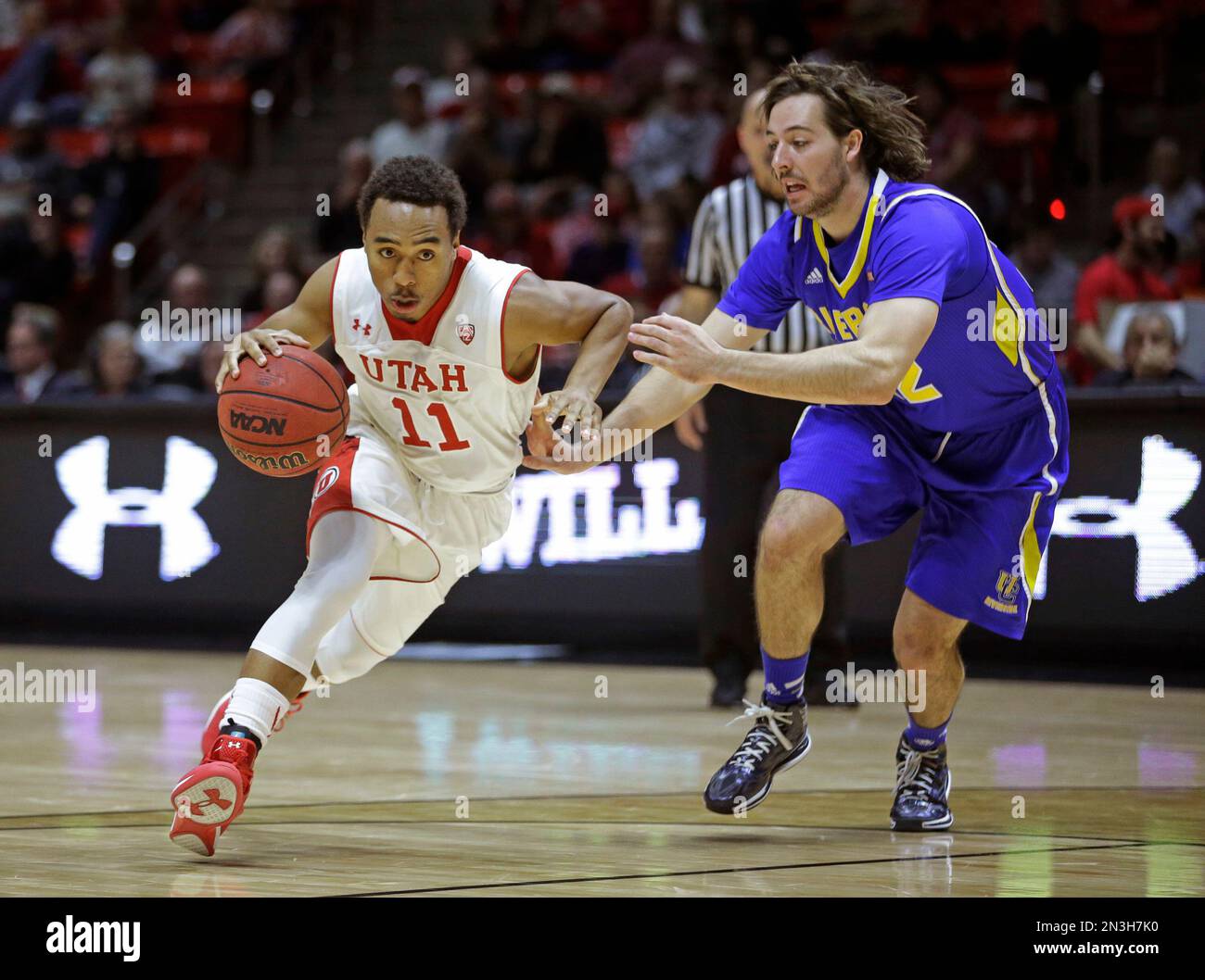 Utah's Brandon Taylor (11) drives around UC Riverside's Colin Gruber ...