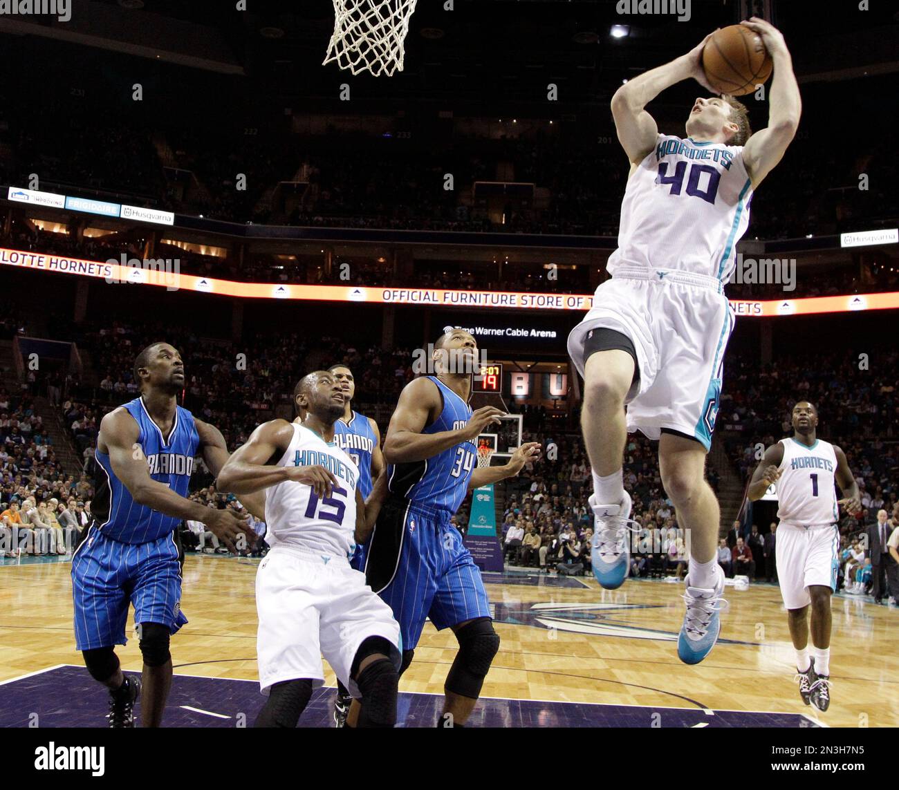 Charlotte Hornets' Cody Zeller (40) shoots against the Orlando Magic ...