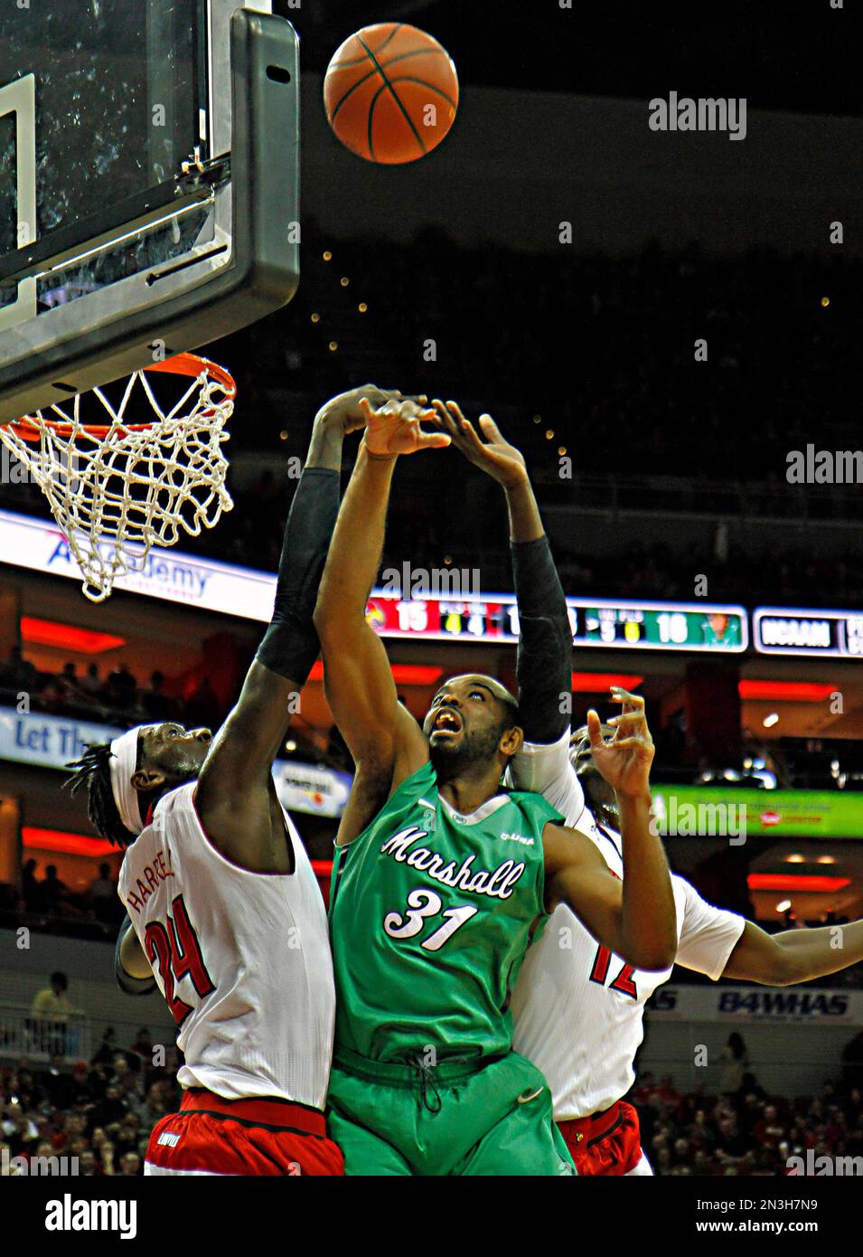 Marshall center JP Kambola (31) battles Louisville's Montrezl Harrell ...