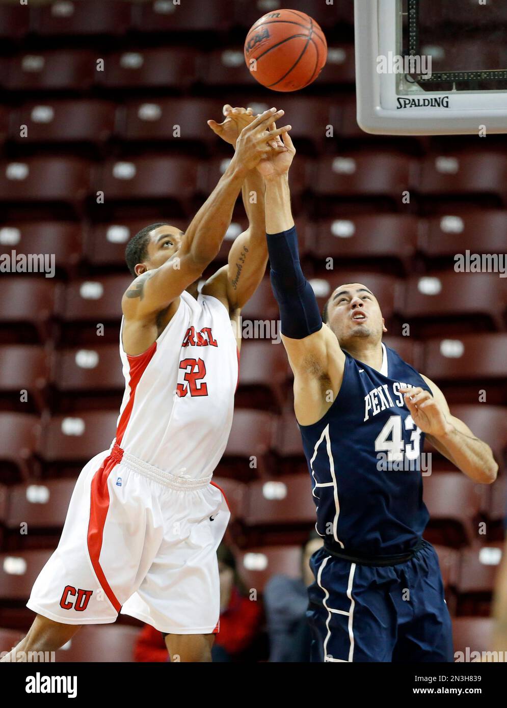Cornell's Shonn Miller, left, fights for a rebound with Penn State's ...