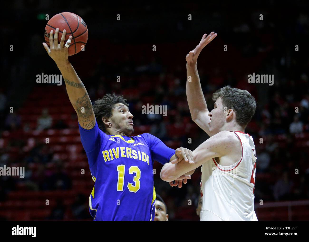 UC Riverside's Steven Thornton (13) shoots as Utah's Jakob Poeltl (42 ...