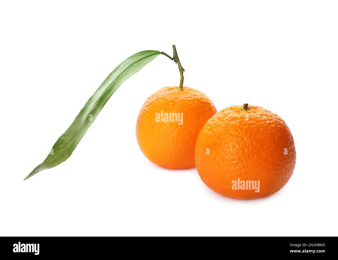 Whole fresh tangerines with green leaf on white background Stock Photo ...