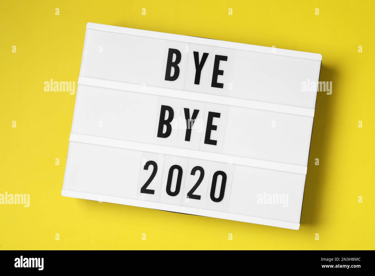 Lightbox with text Bye Bye 2020 on yellow background, top view Stock ...