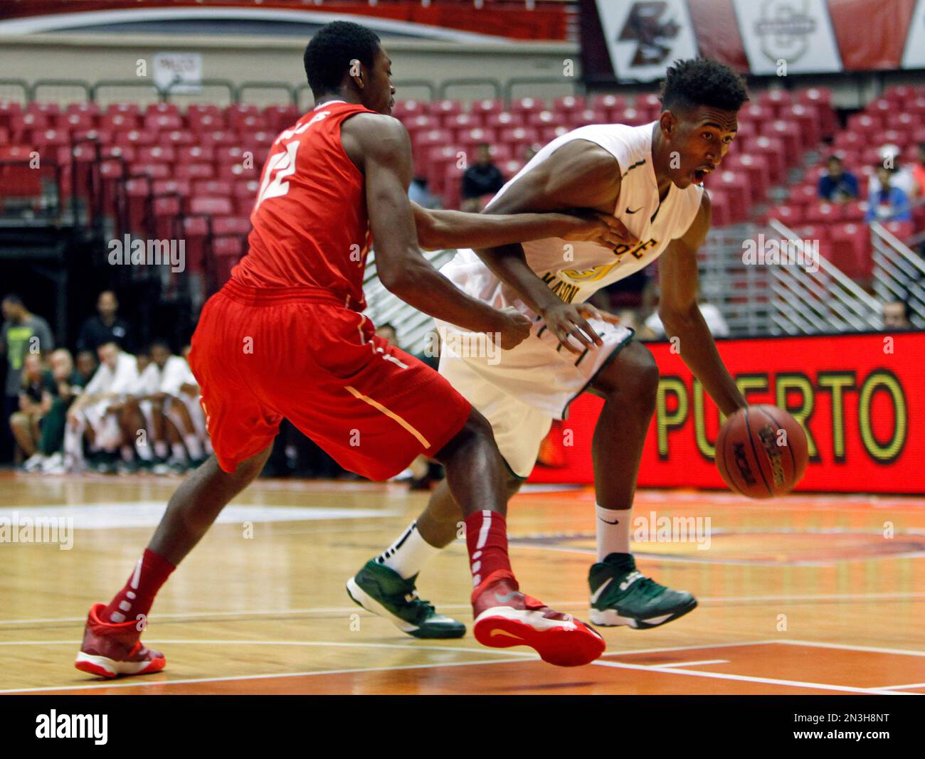 New Mexico guard Devon Williams, left, pressures George Mason Jalen ...