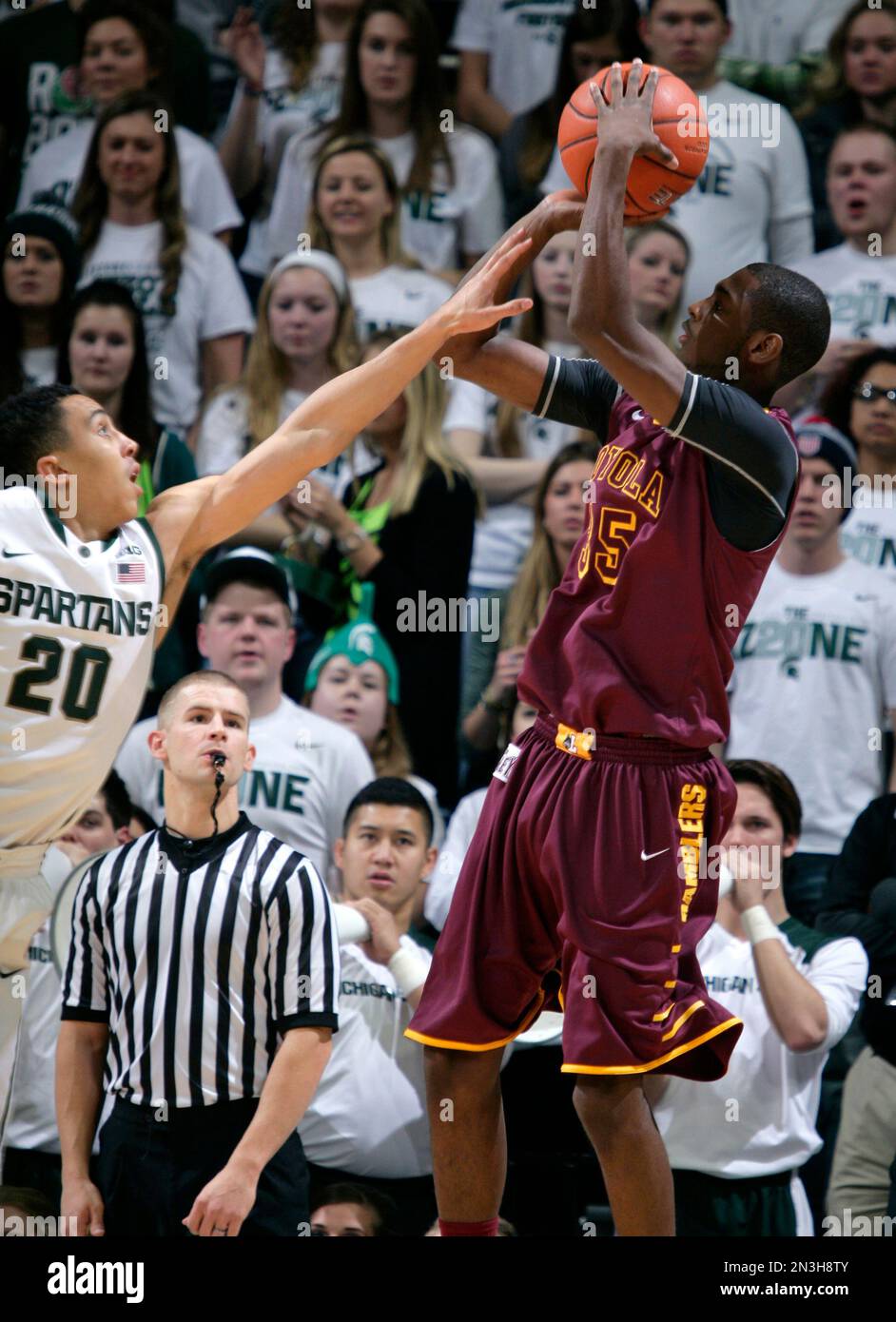 Loyola's Milton Doyle, right, shoots against Michigan State's Travis ...